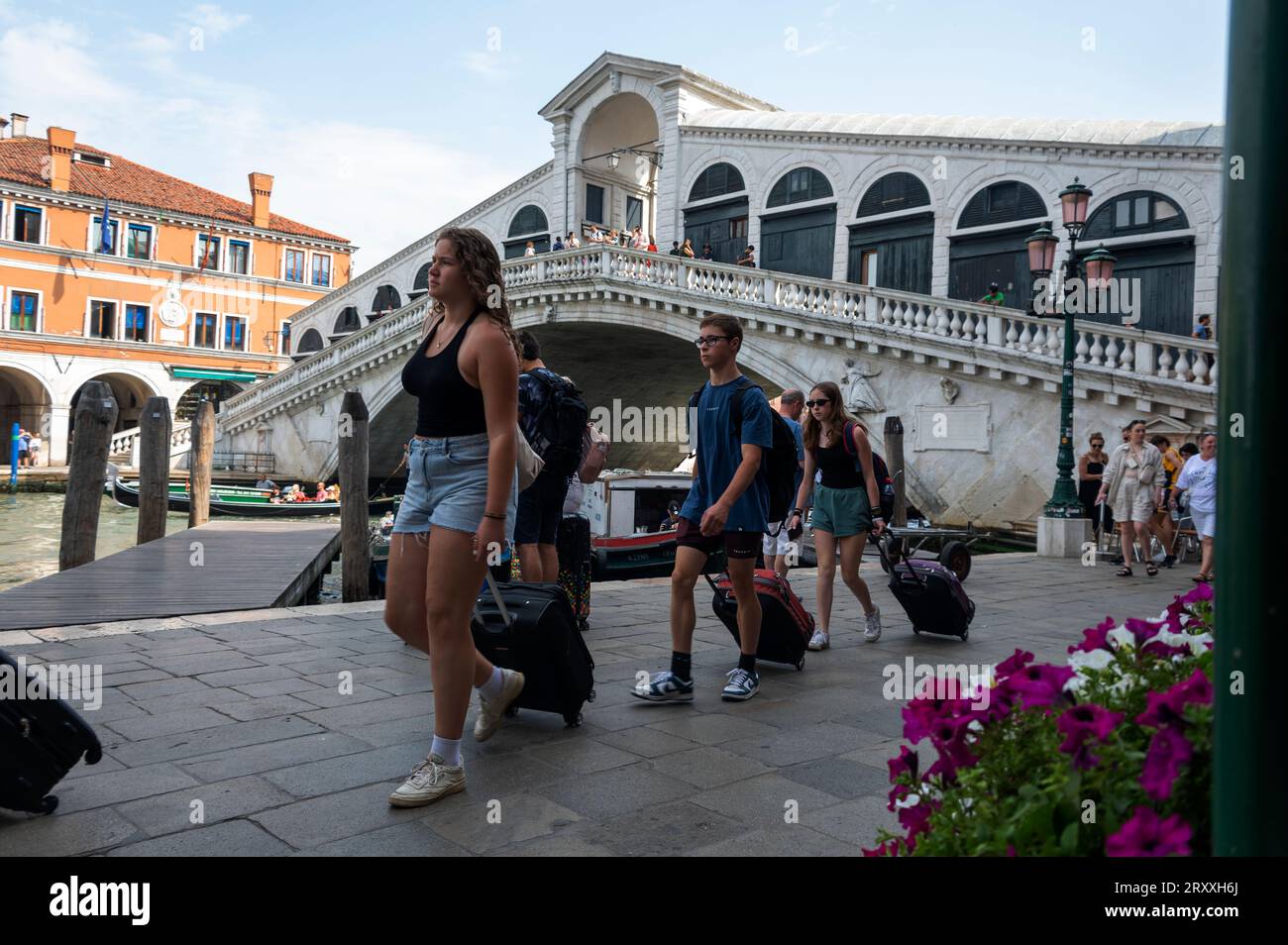 Early risers stroll passed a few moored barges, delivering daily fresh ...