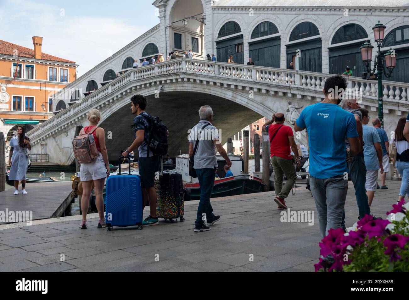Early risers stroll passed a few moored barges, delivering daily fresh ...