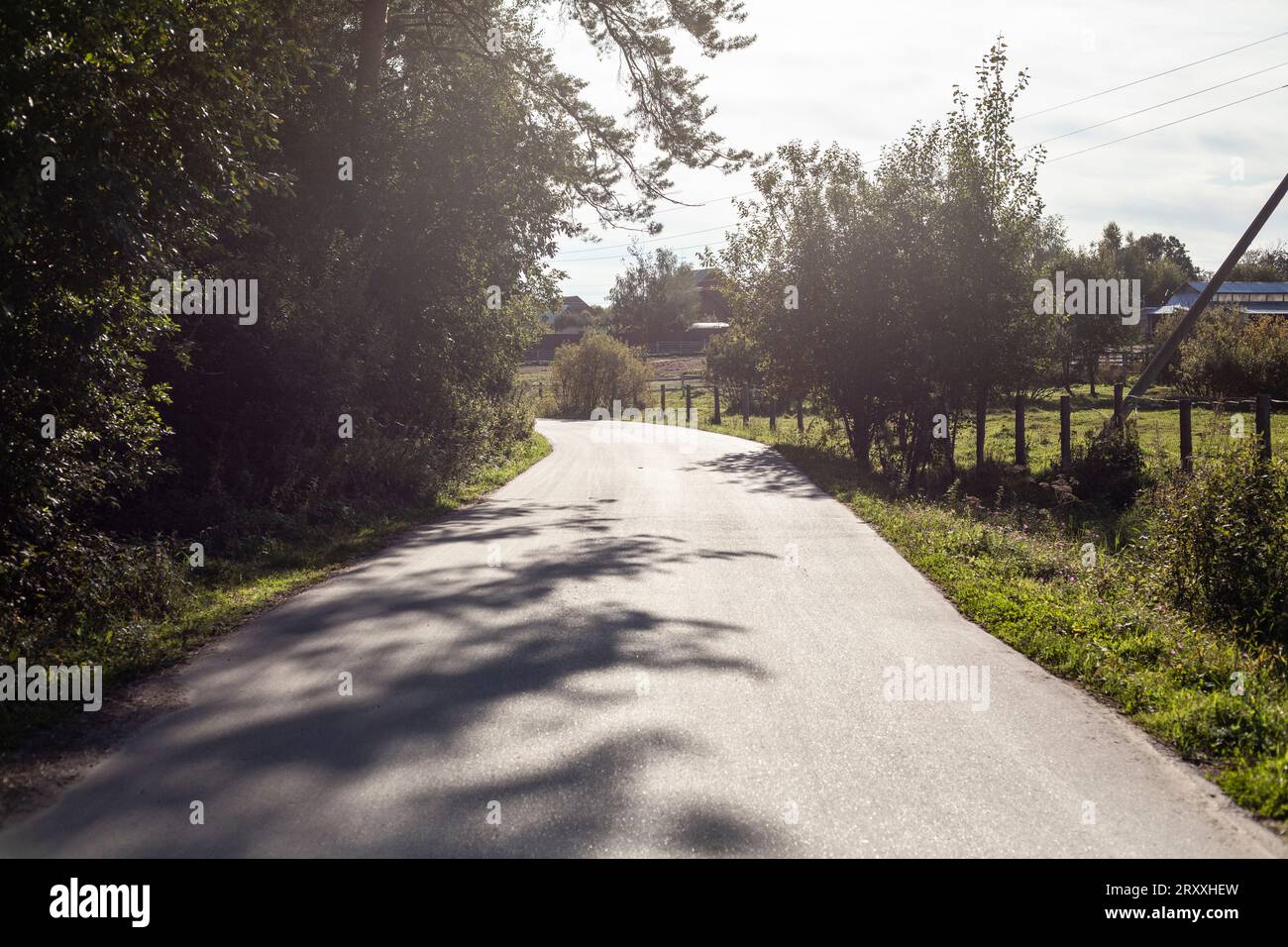 The Road to the Farm. Highway in the countryside. Narrow road in summer ...