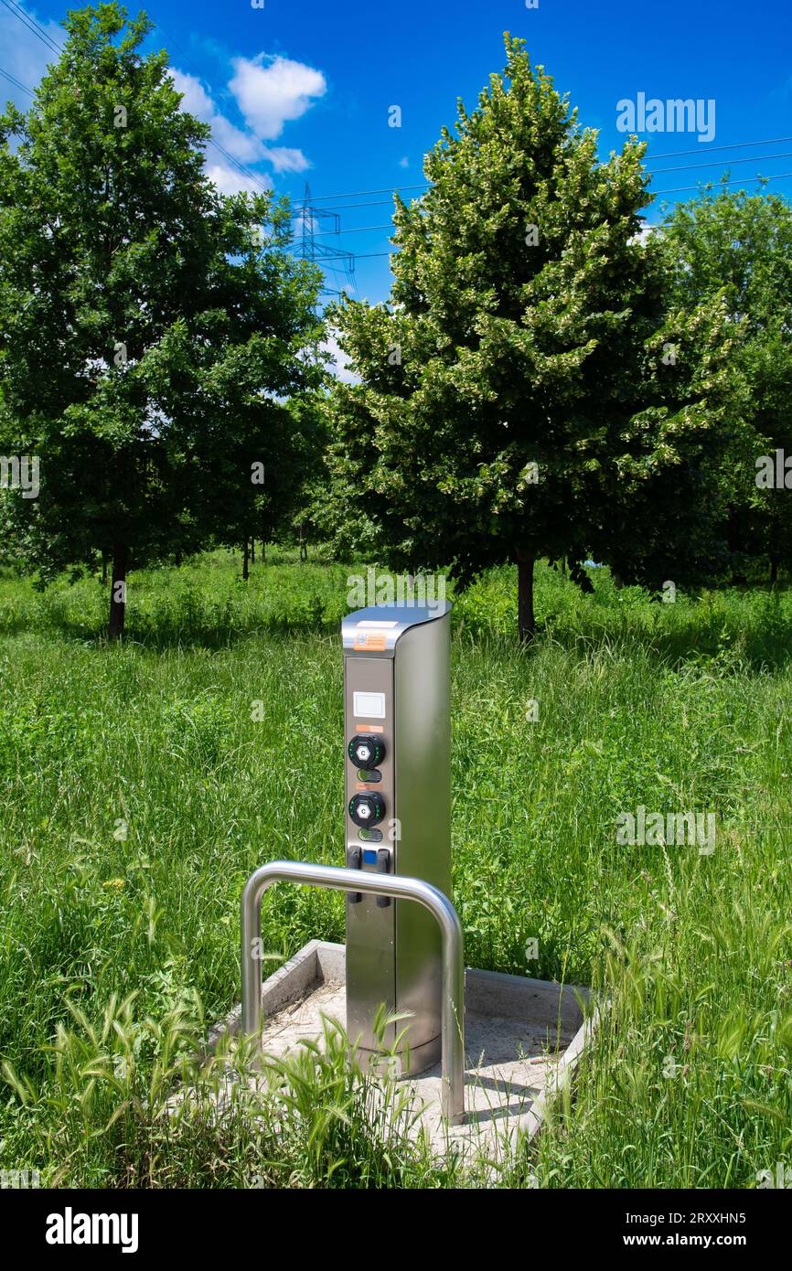 Charging Station For Electric Cars In Green Meadow In Front Of Trees ...