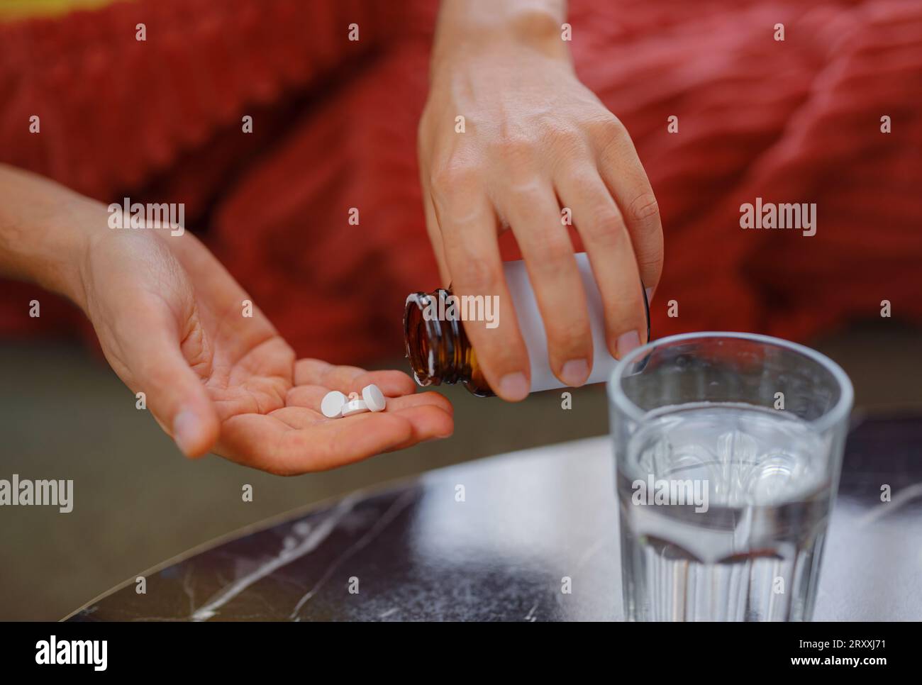 adult sick ill man hold pills on hand pouring capsules from medication ...