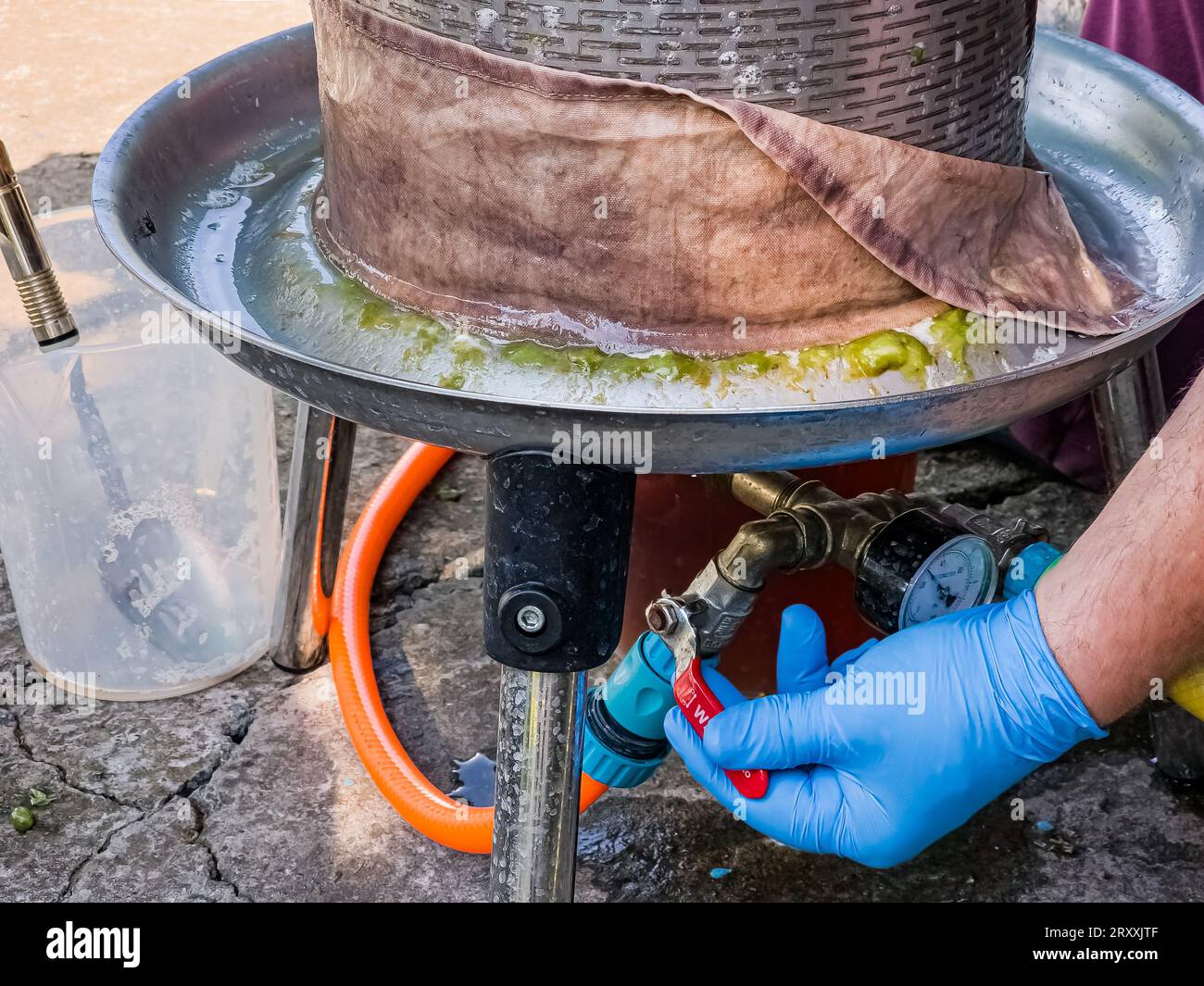 The process of making homemade grape wine. The operation of a hydraulic ...
