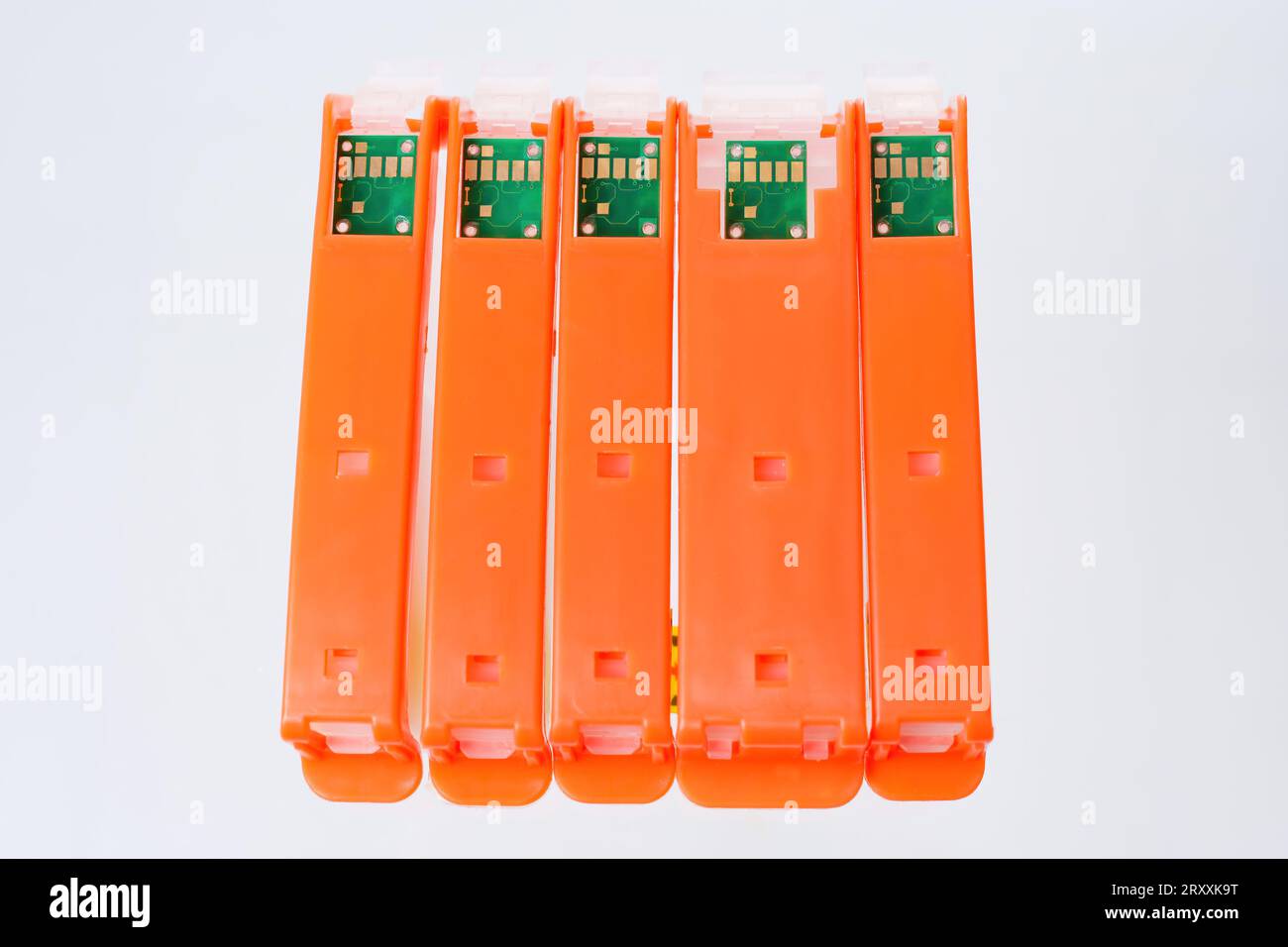 Set of five refillable inkjet printer cartridges isolated on grey, rear ...