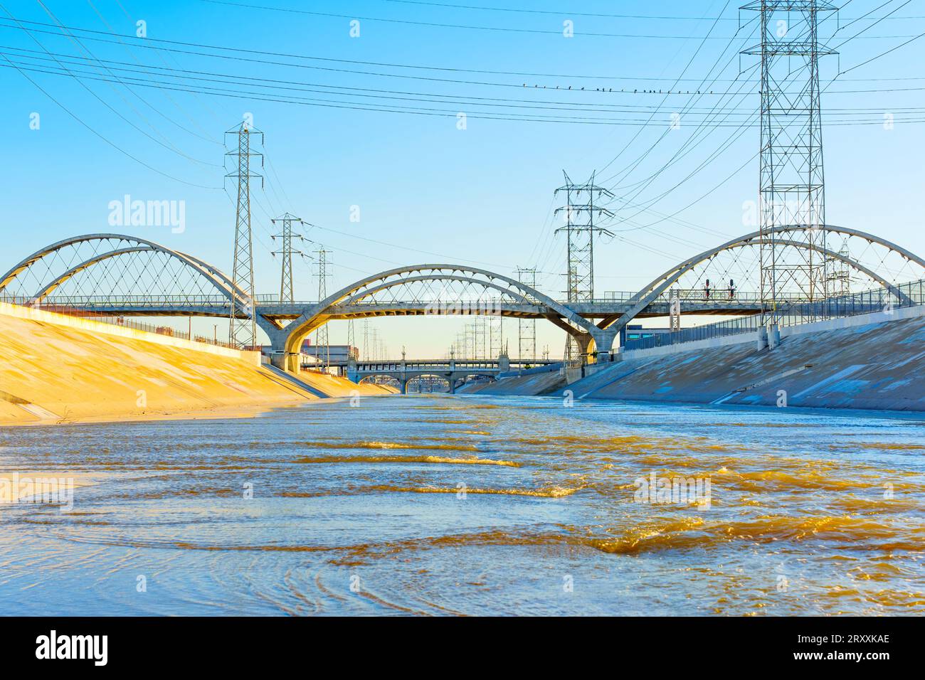 View of two bridges over the raging Los Angeles River on a sunny winter ...