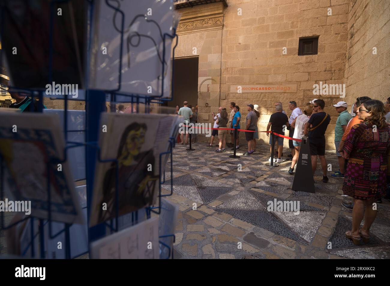 Tourists are seen in a queue outside the Picasso Museum as they wait to ...