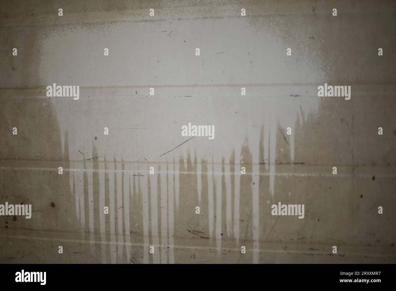 Stain on the wall. Paint was dripping down the wall. White stain from ...