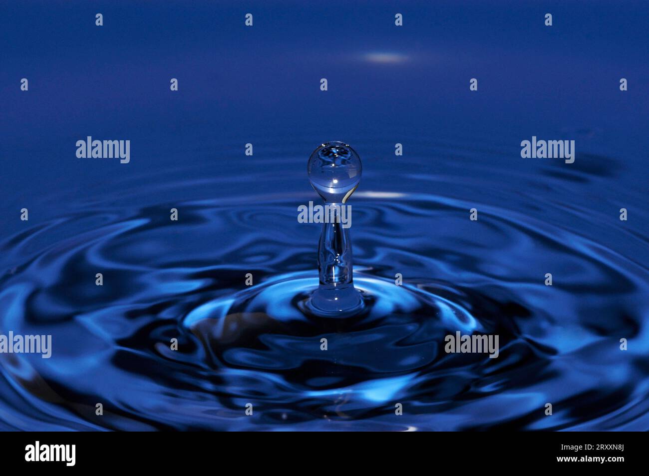 Falling drop of water Stock Photo - Alamy