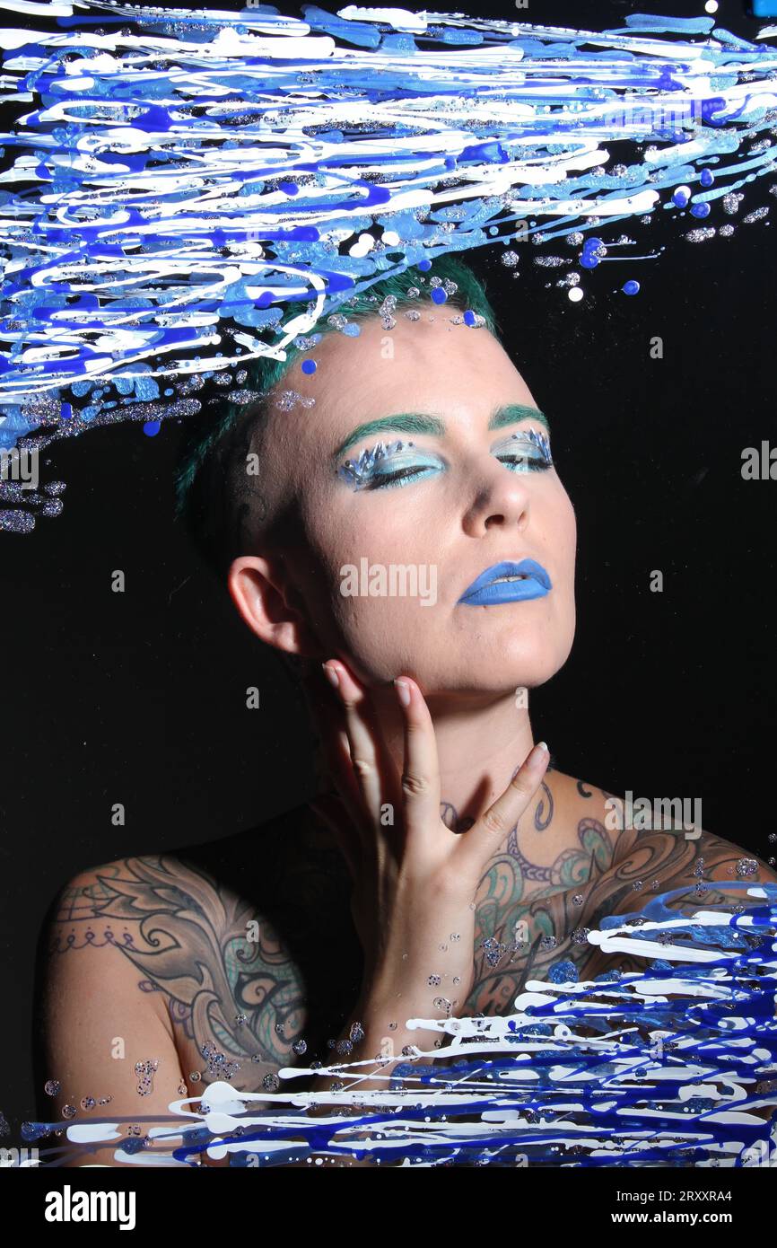 Photoshoot of a model behind glass Stock Photo - Alamy