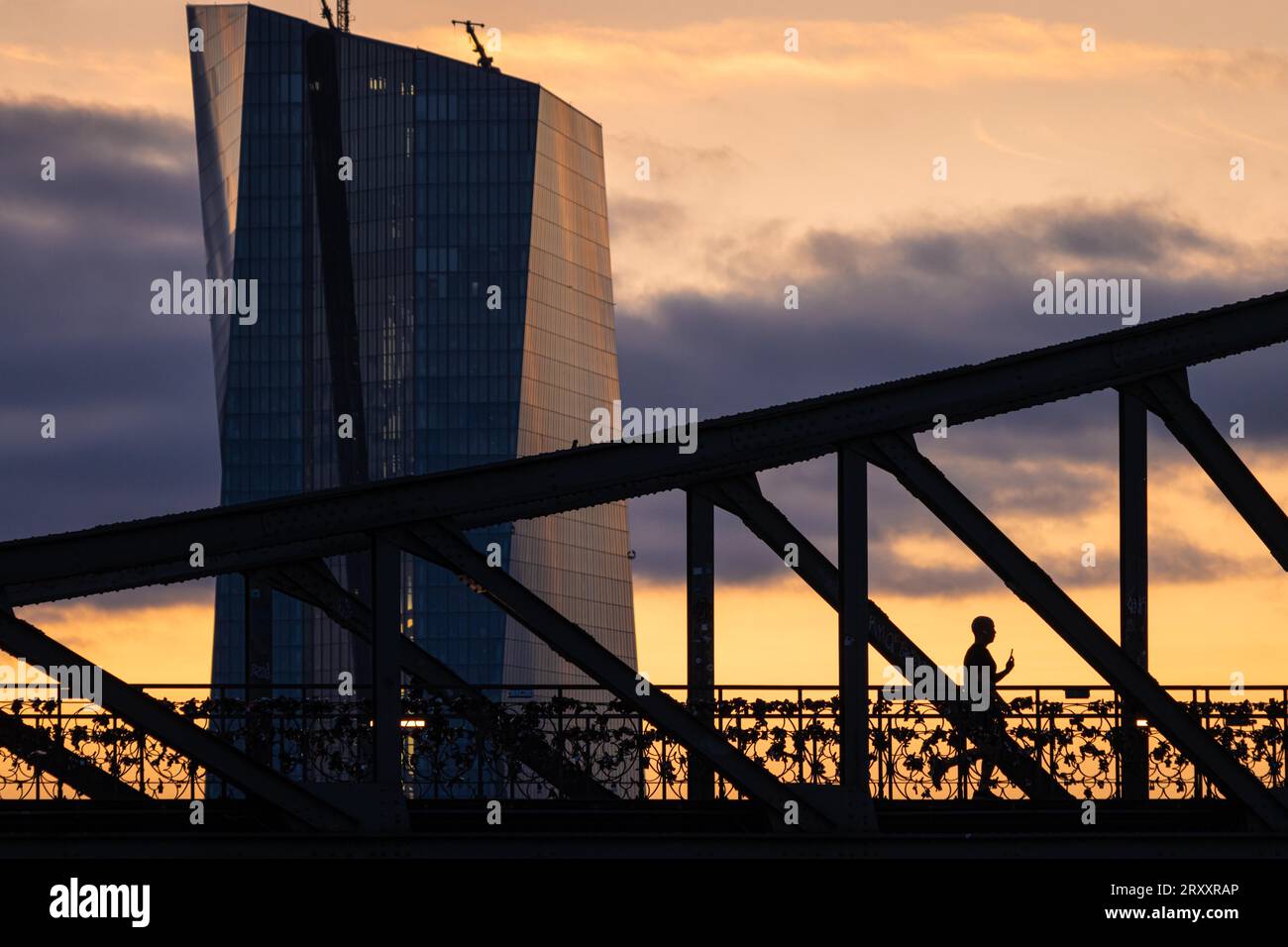 The sun rises behind the European Central Bank (ECB) in Frankfurt am ...