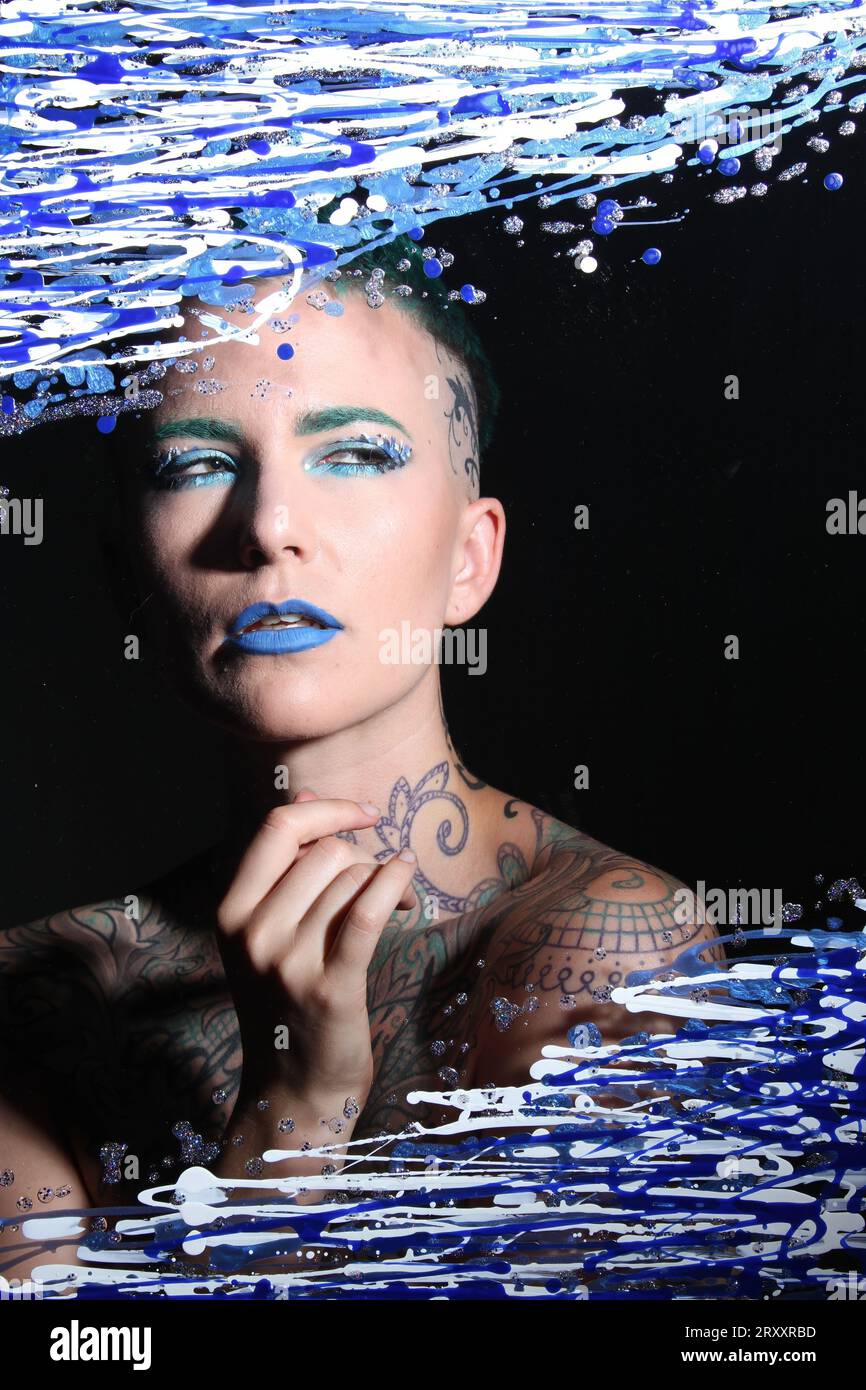 Photoshoot of a model behind glass Stock Photo - Alamy