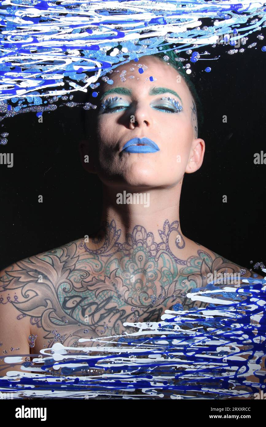 Photoshoot of a model behind glass Stock Photo - Alamy