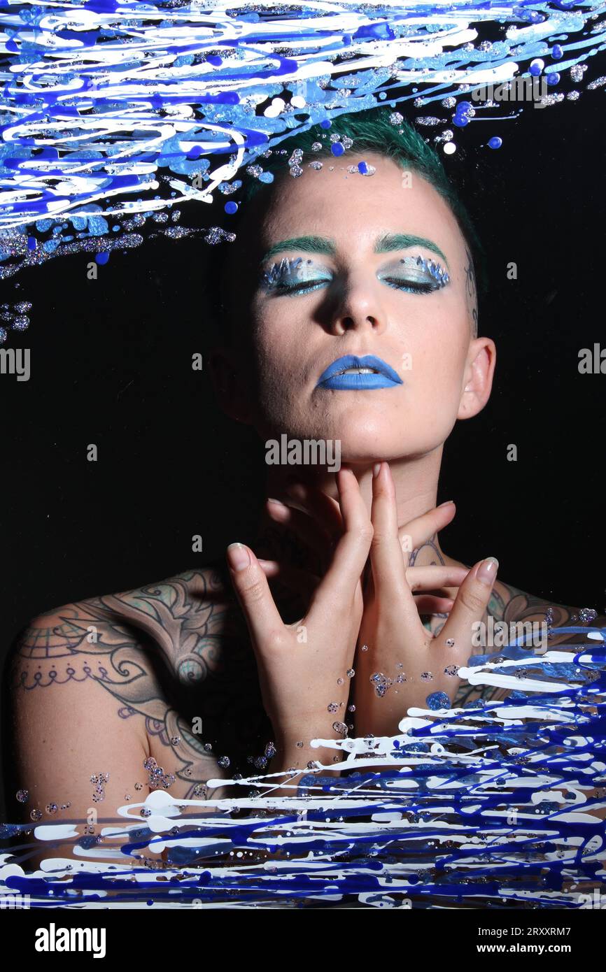 Photoshoot of a model behind glass Stock Photo - Alamy