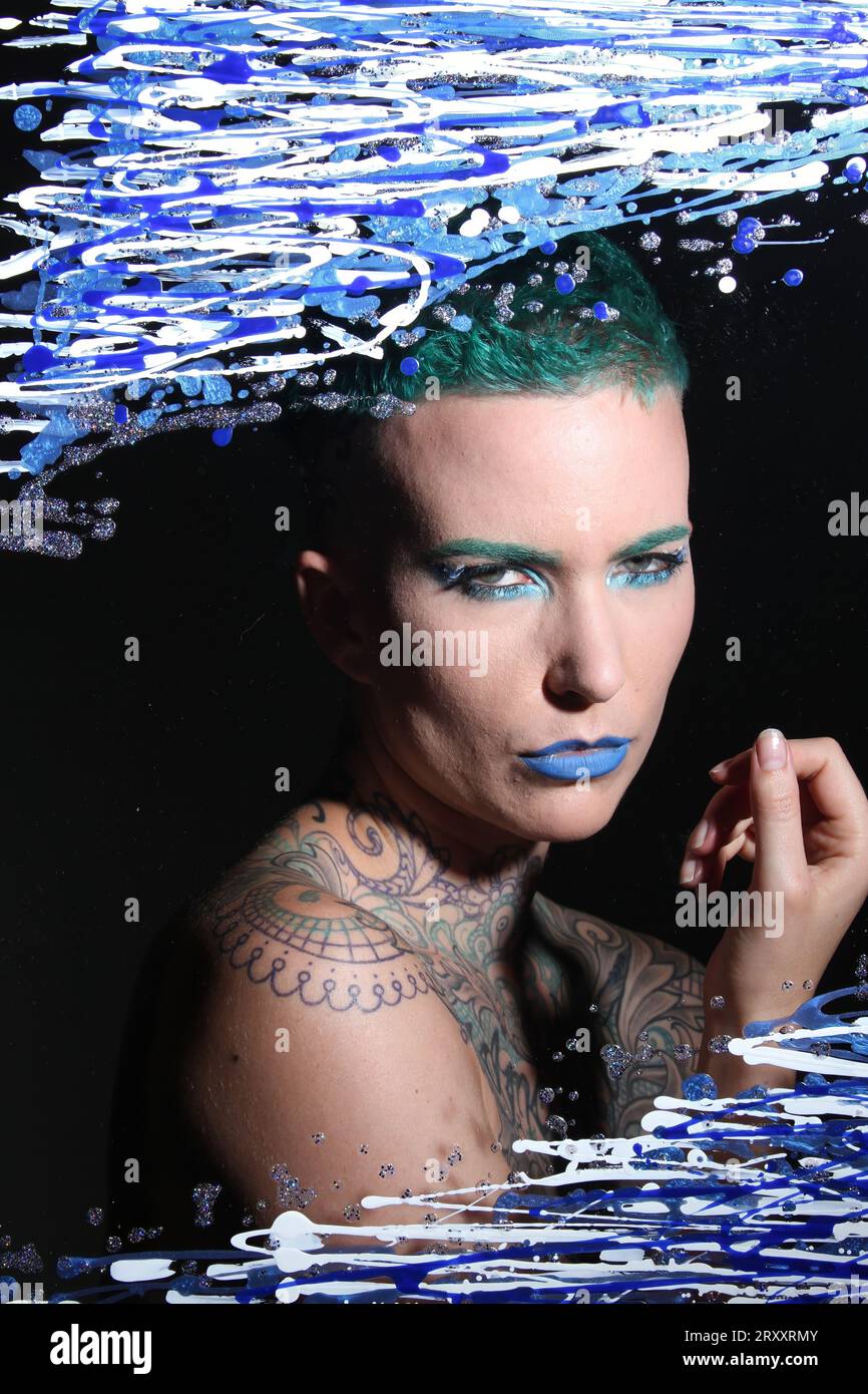 Photoshoot of a model behind glass Stock Photo - Alamy