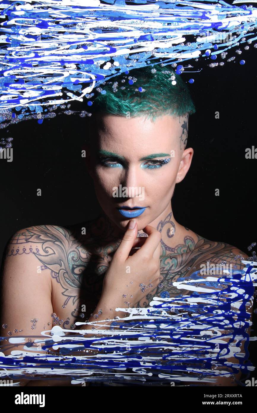 Photoshoot of a model behind glass Stock Photo - Alamy