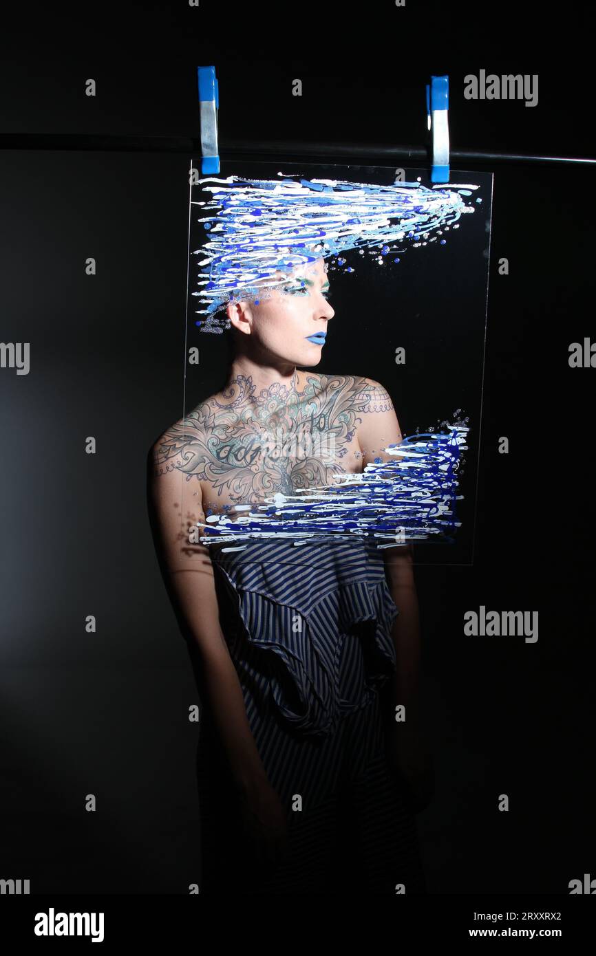 Photoshoot of a model behind glass Stock Photo - Alamy