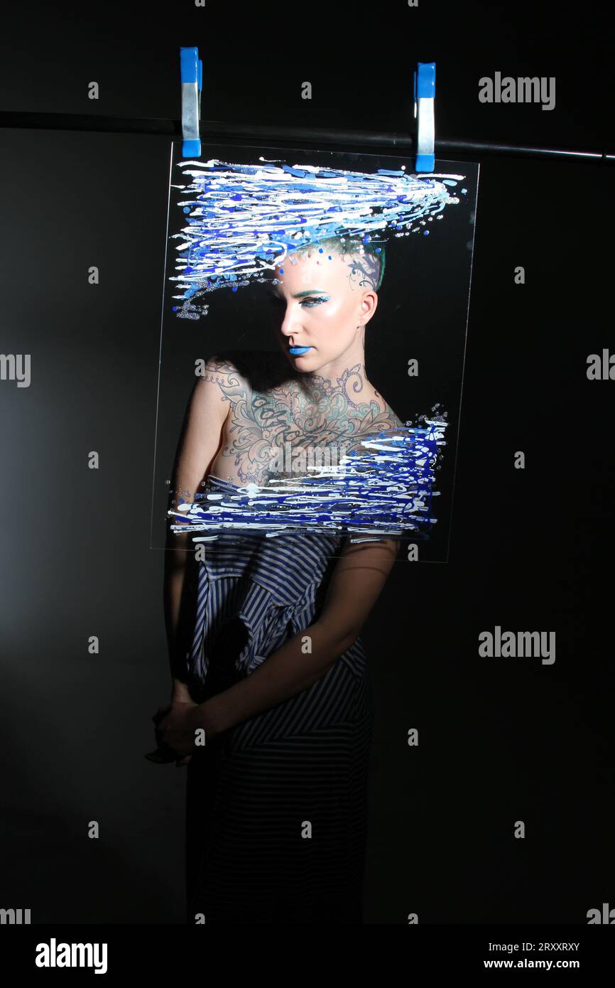 Photoshoot of a model behind glass Stock Photo - Alamy