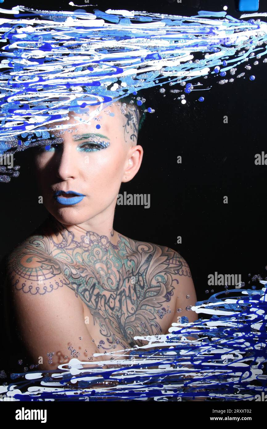 Photoshoot of a model behind glass Stock Photo - Alamy