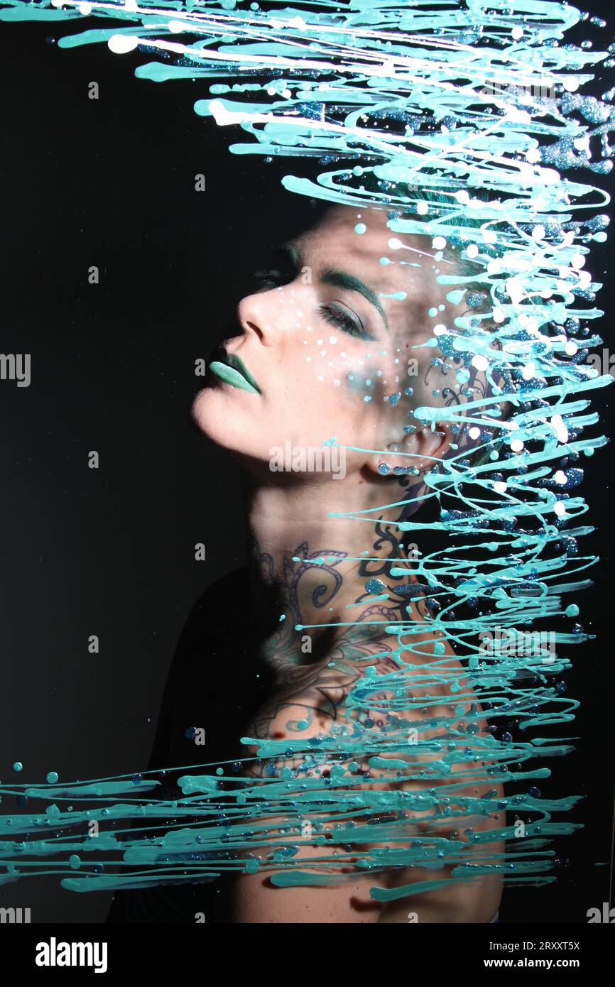 Photoshoot of a model behind glass Stock Photo - Alamy