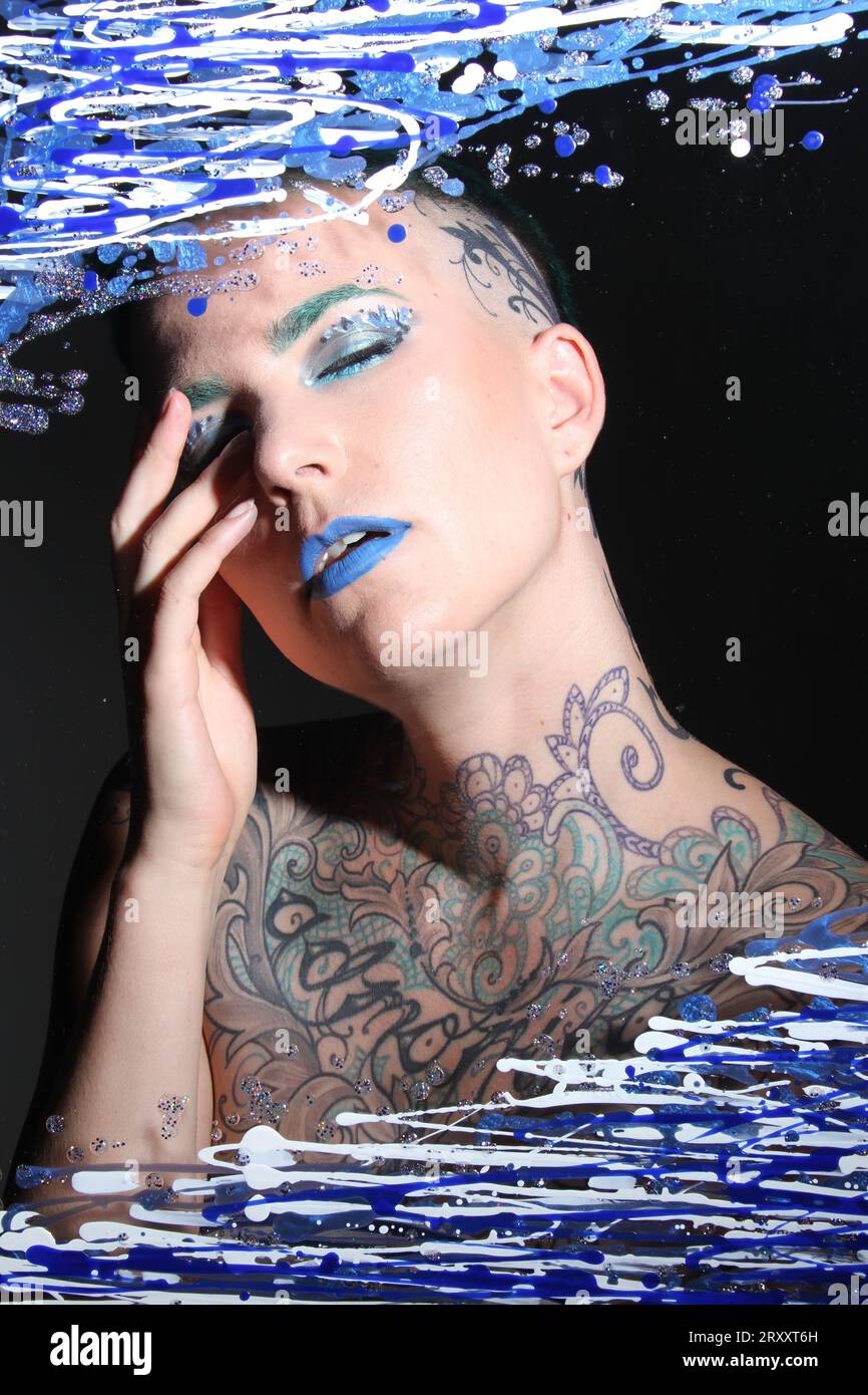 Photoshoot of a model behind glass Stock Photo - Alamy