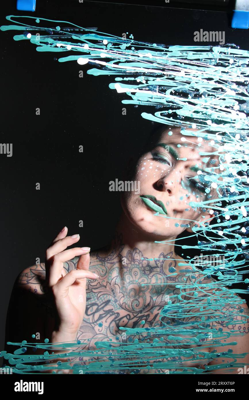 Photoshoot of a model behind glass Stock Photo - Alamy