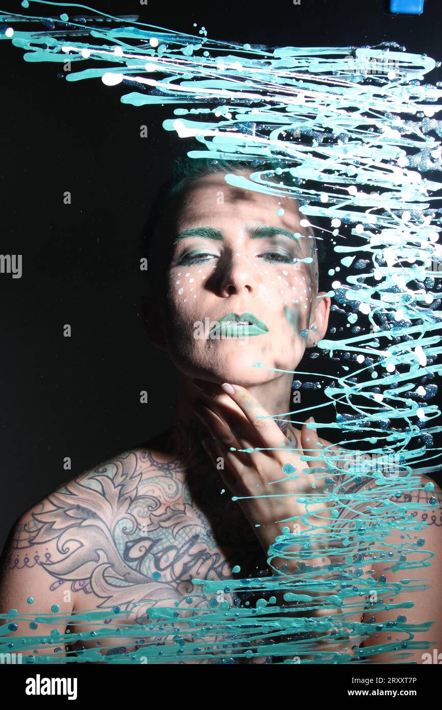 Photoshoot of a model behind glass Stock Photo - Alamy