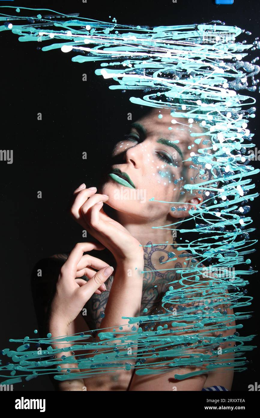 Photoshoot of a model behind glass Stock Photo - Alamy