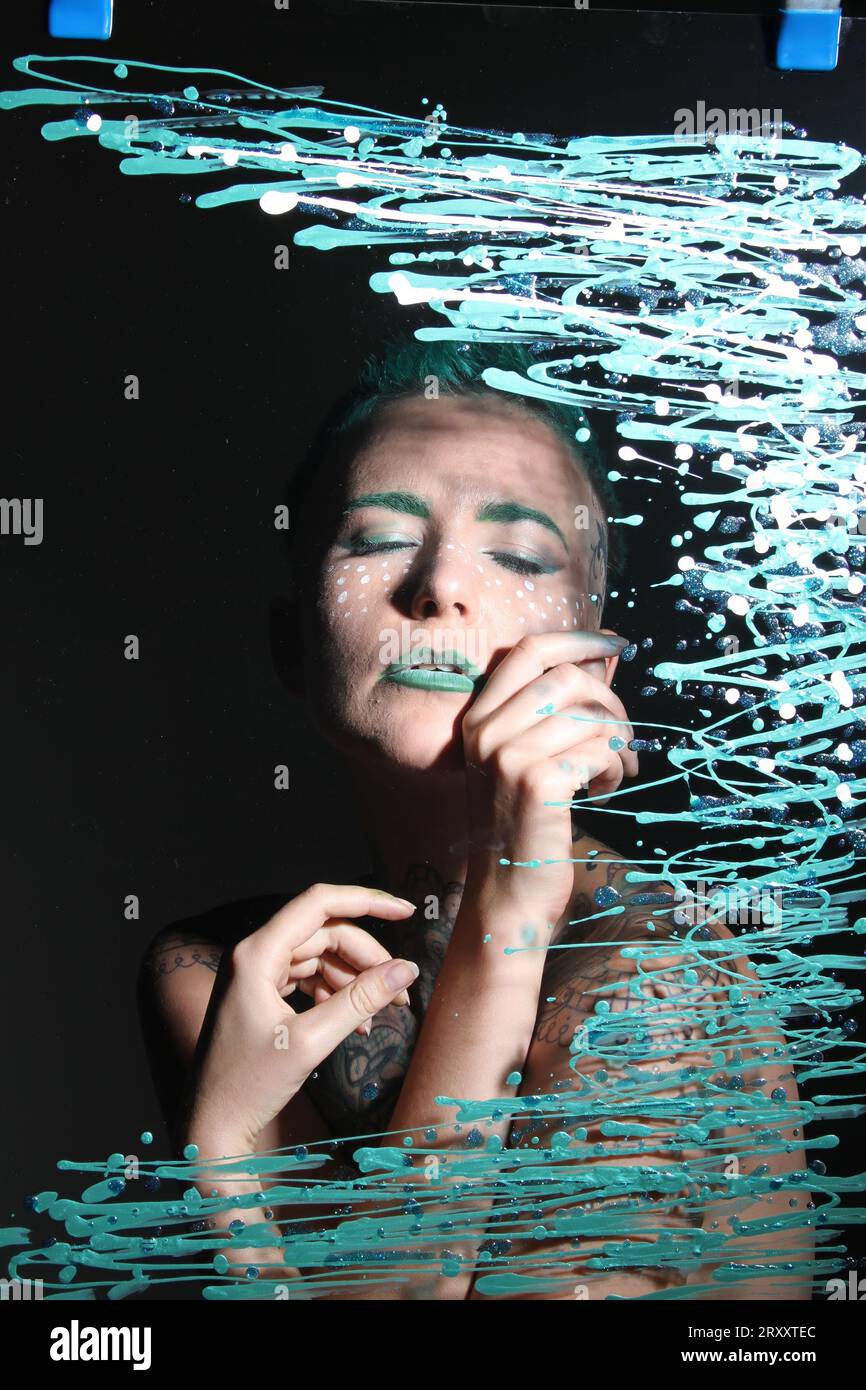 Photoshoot of a model behind glass Stock Photo - Alamy