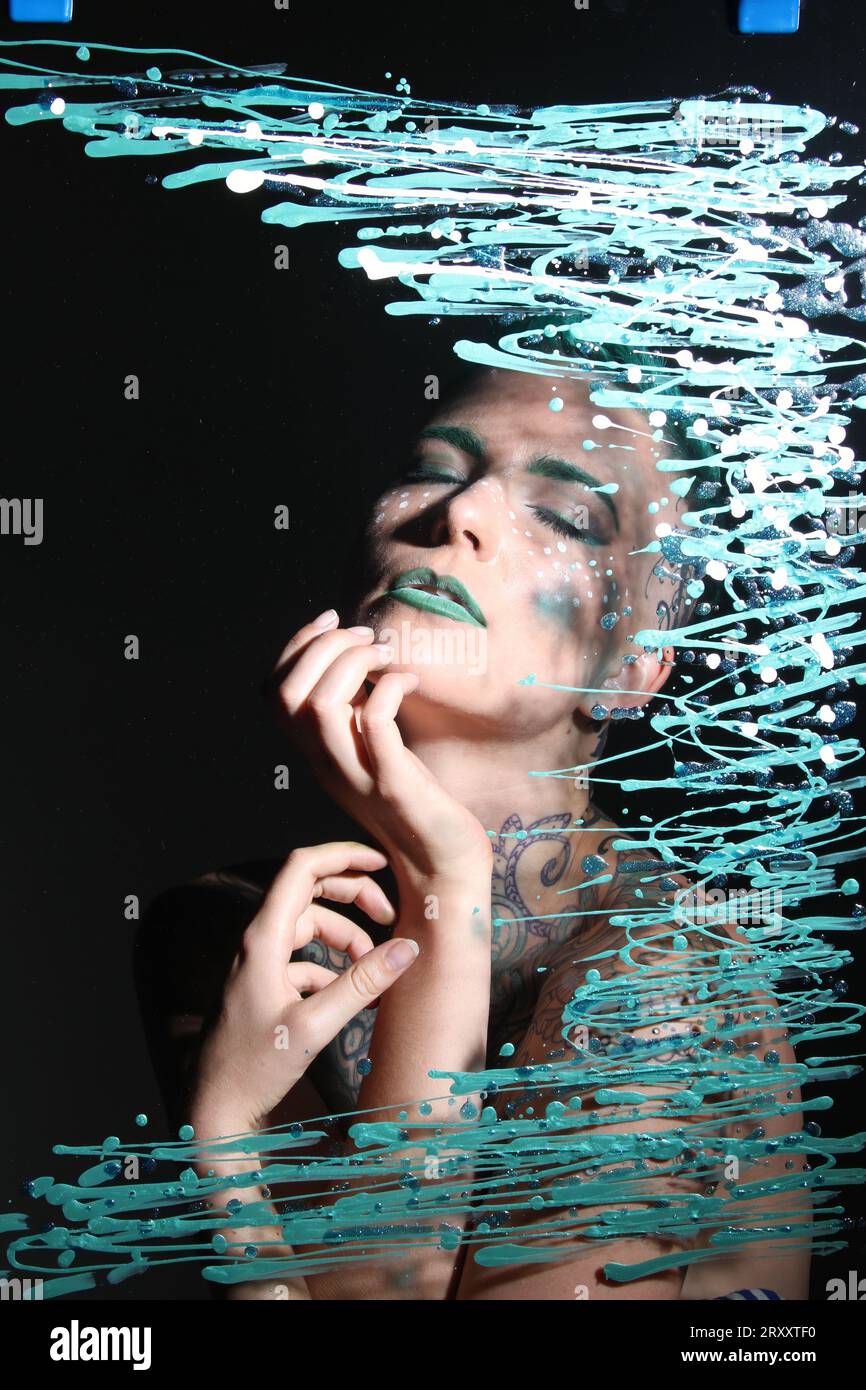 Photoshoot of a model behind glass Stock Photo - Alamy