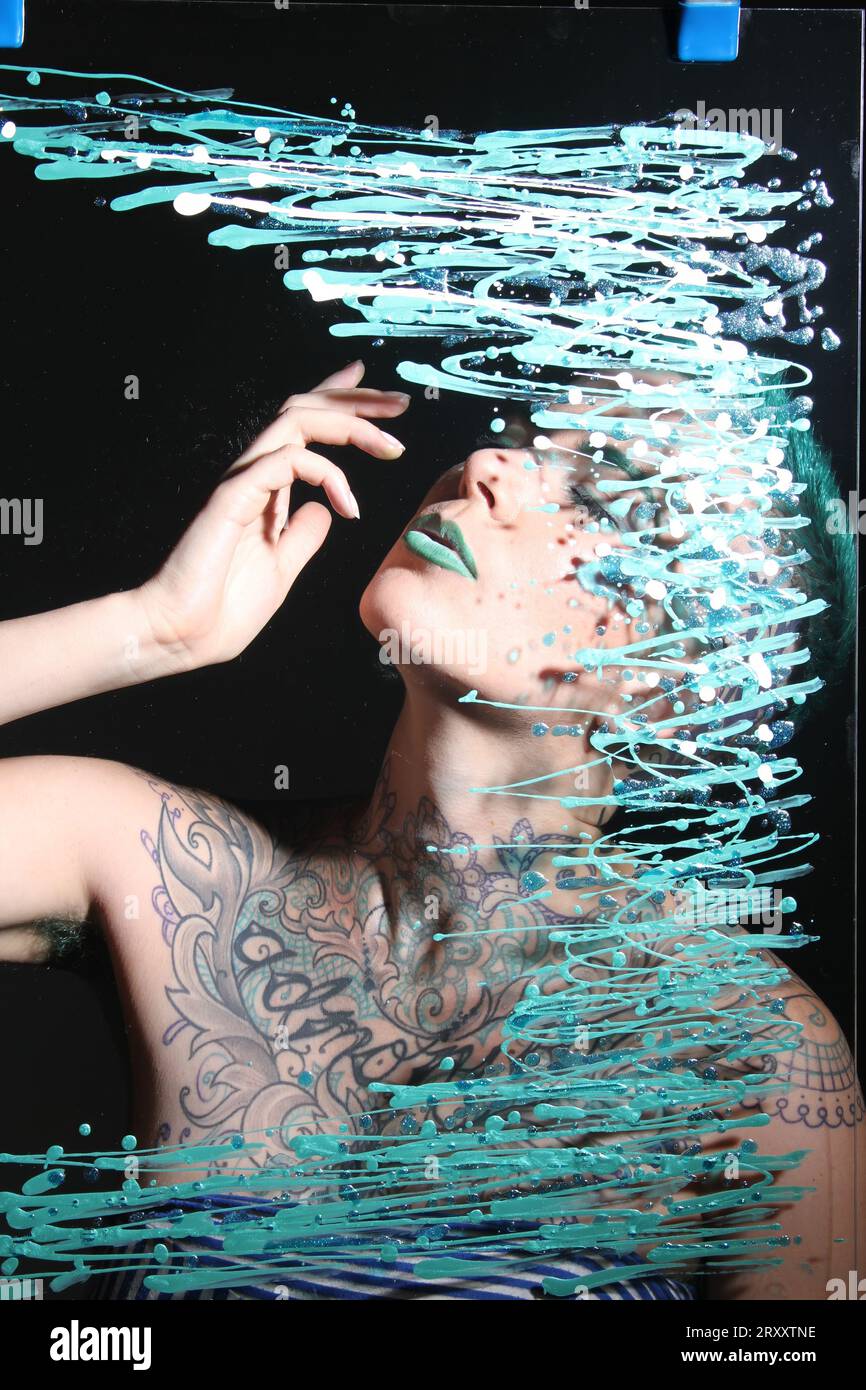 Photoshoot of a model behind glass Stock Photo - Alamy