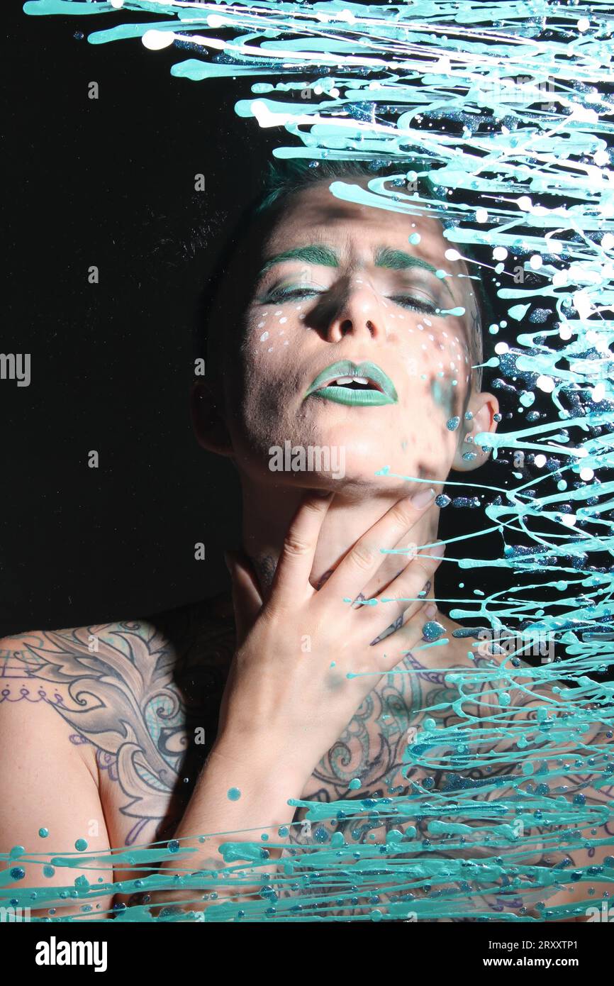 Photoshoot of a model behind glass Stock Photo - Alamy