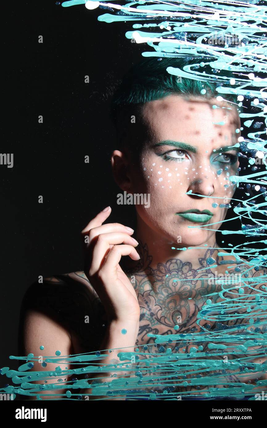 Photoshoot of a model behind glass Stock Photo - Alamy