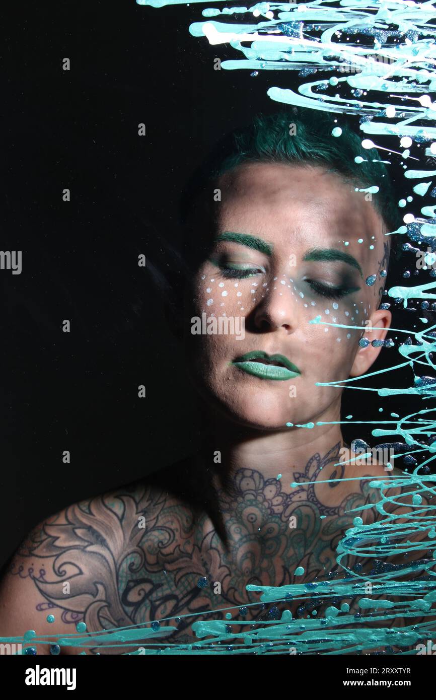 Photoshoot of a model behind glass Stock Photo - Alamy