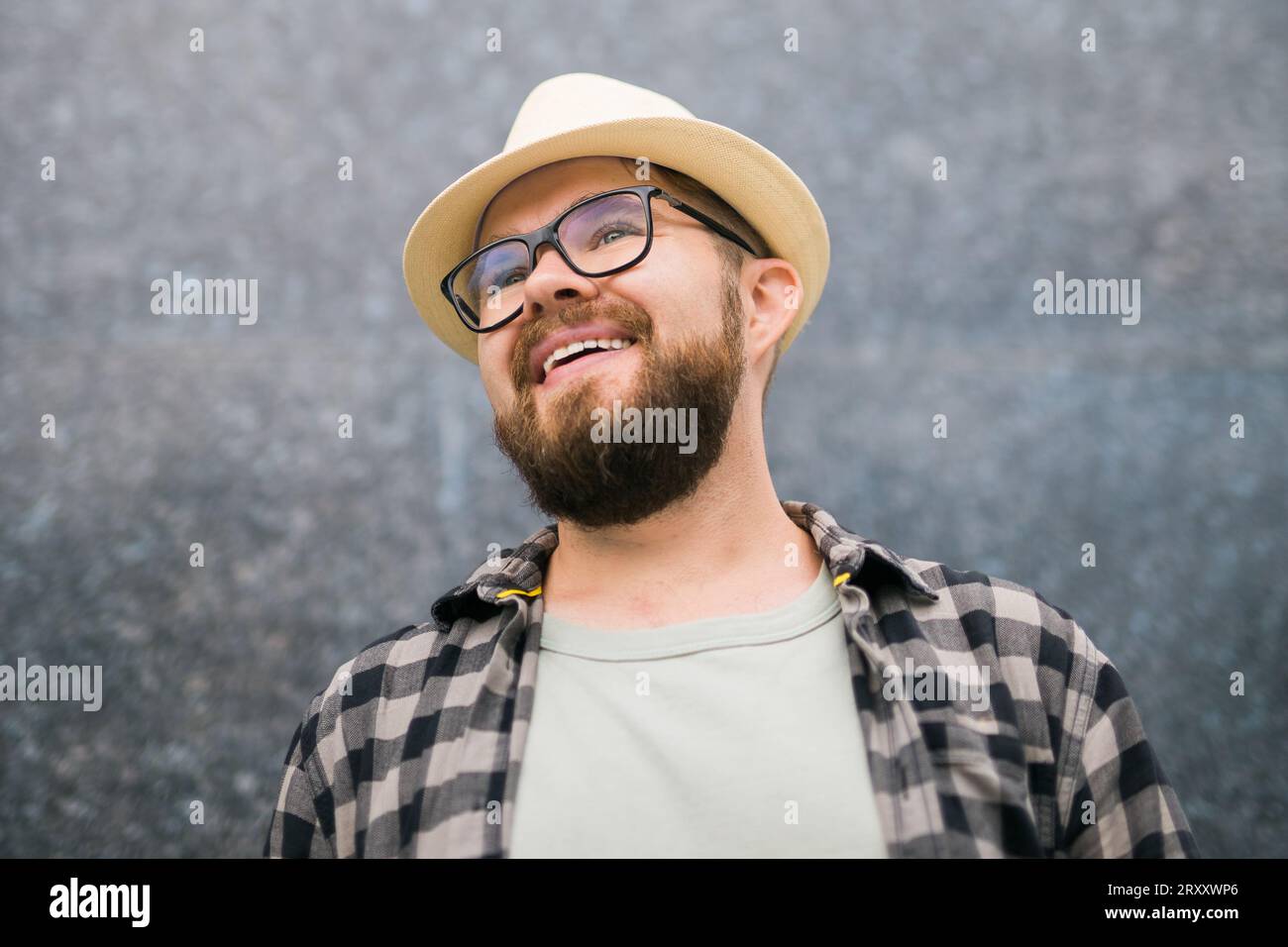 Close-up portrait handsome millennial man tourist looking happy wearing ...