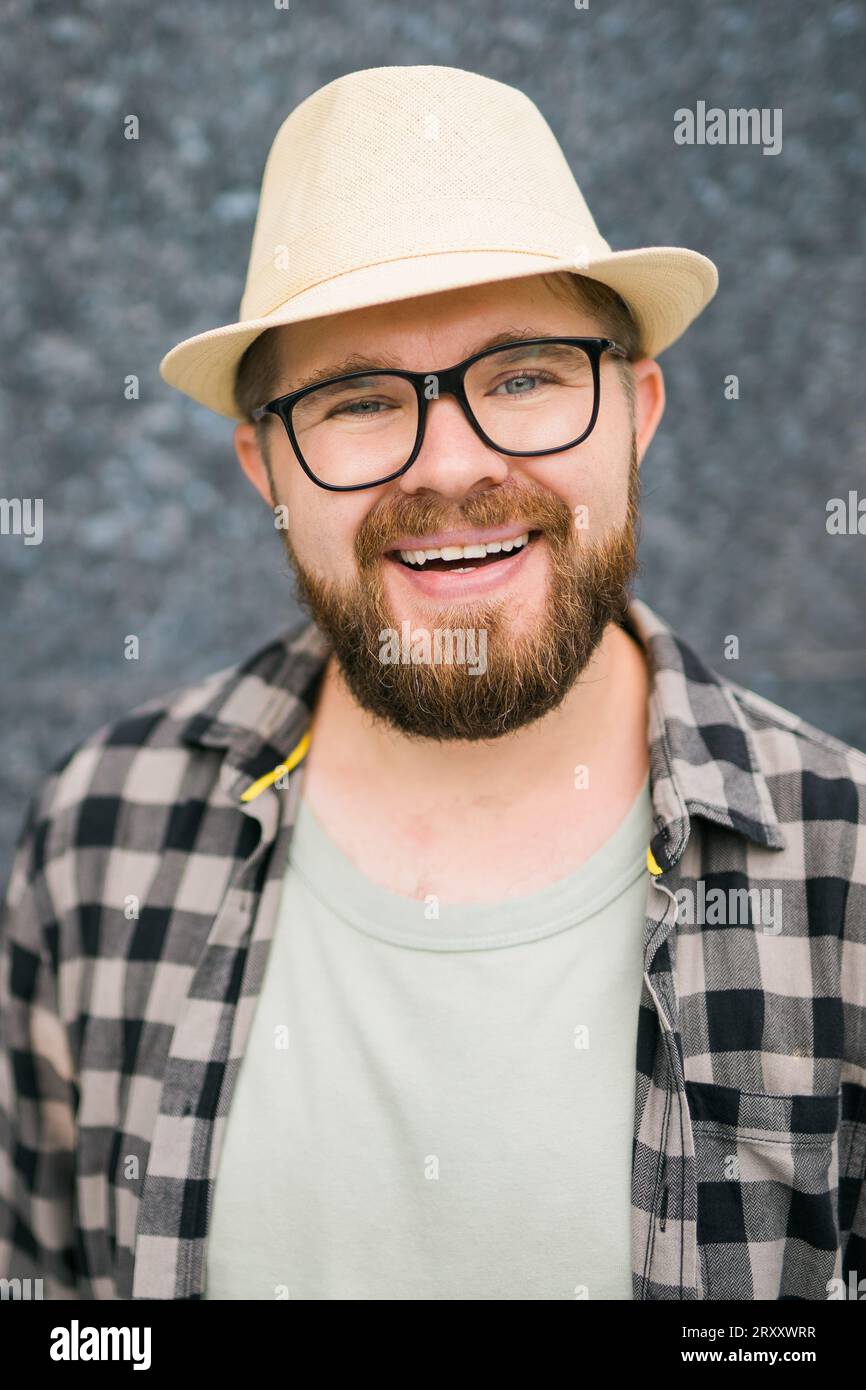 Close-up portrait handsome millennial man tourist looking happy wearing ...