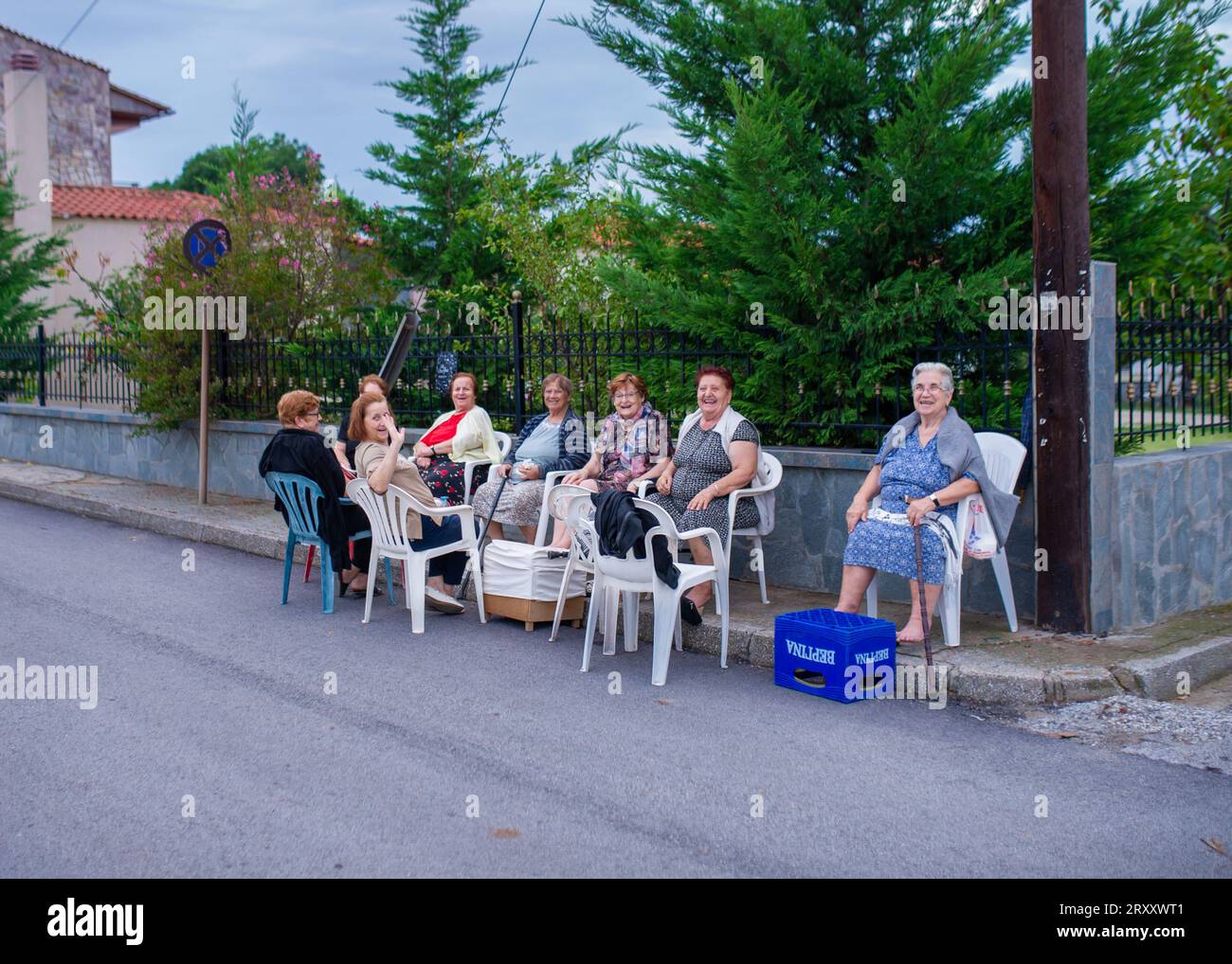 20 August 2022-Roditis-Greece- Elderly women sitting on chairs in the ...