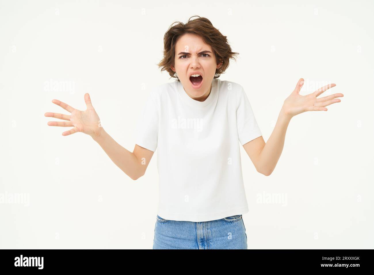 Portrait of woman throwing tantrum, shouting and screaming, shaking ...