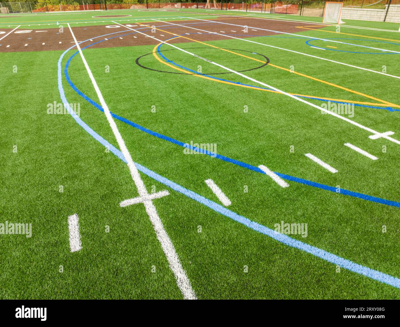 New synthetic turf field with football and baseball with lines and ...