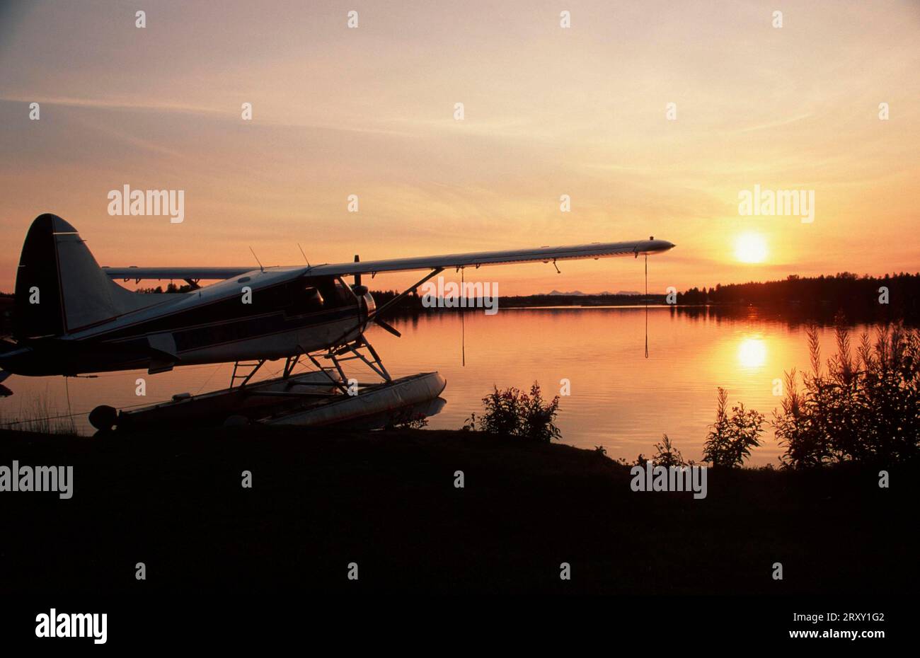 Lake Hood at sunset with seaplane, Anchorage, Alaska, USA Stock Photo ...