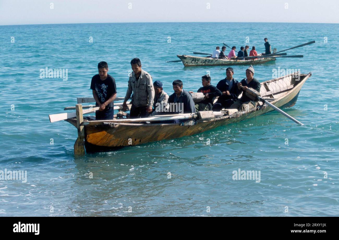 Chukchi Eskimos in umiak, a traditional boat made of walrus skin ...