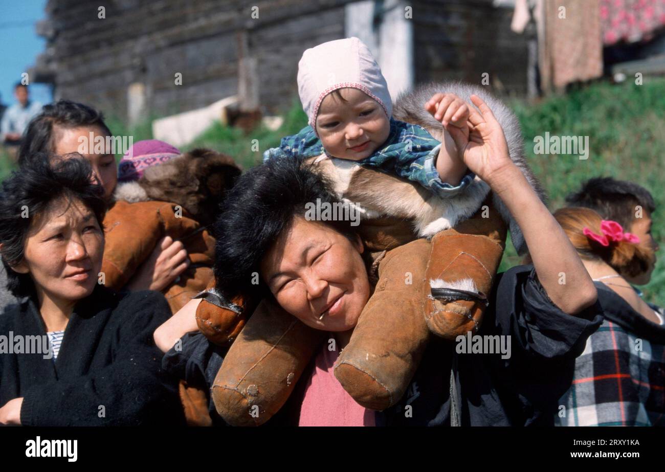 Chukchi Eskimo woman with child, Yanrakino village, province Chukotka ...