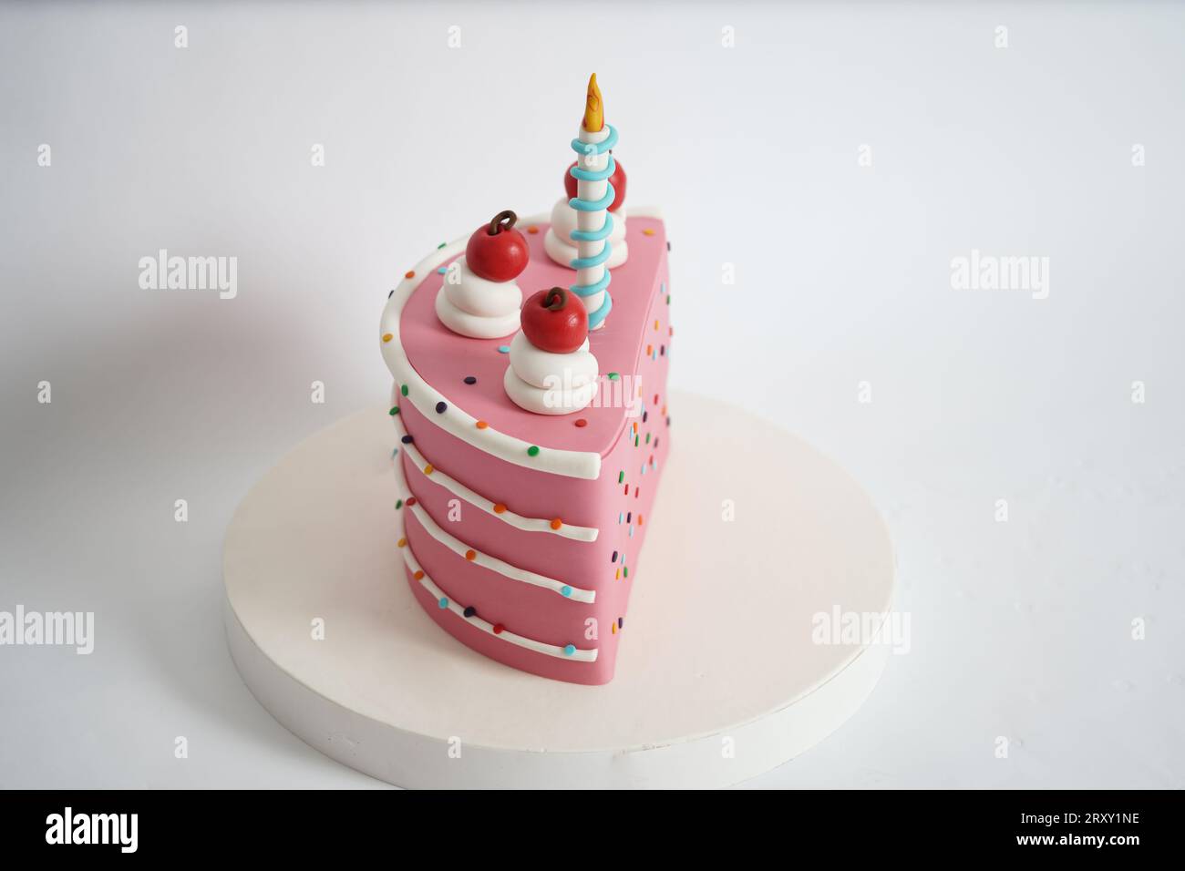 Half Birthday cake. A cute pink half birthday cake with candle and ...