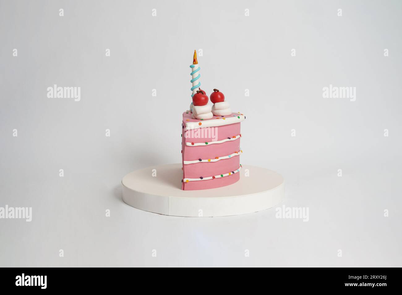 Half Birthday cake. A cute pink half birthday cake with candle and ...