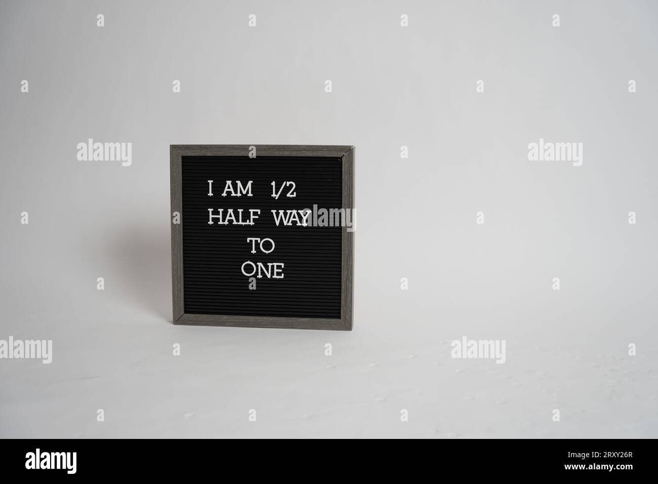 I'm halfway to one years old. half way to one black board on a white ...