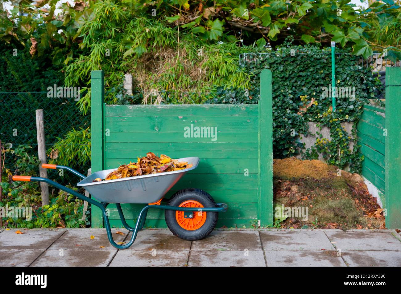 Compost box with wheelbarrow Stock Photo - Alamy