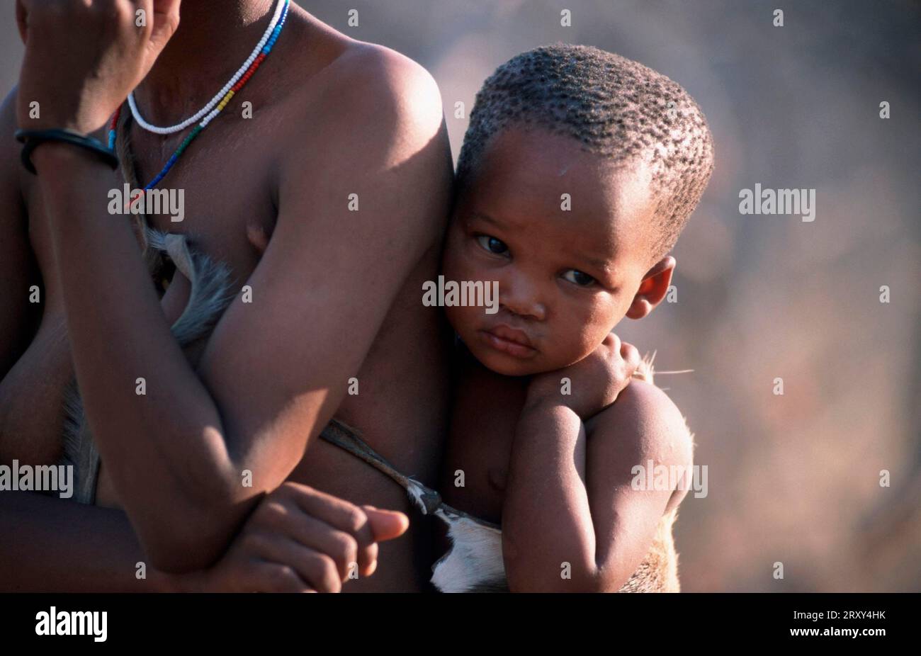 Bushman child on mother's back, africa, San, Bushmen, Bushmen, people ...