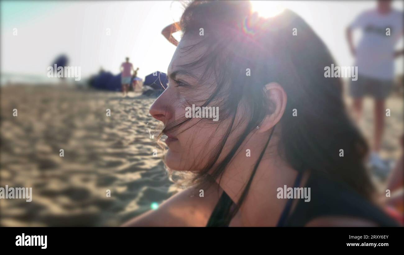 Pensive young woman at the beach. Contemplative thoughtful woman ...