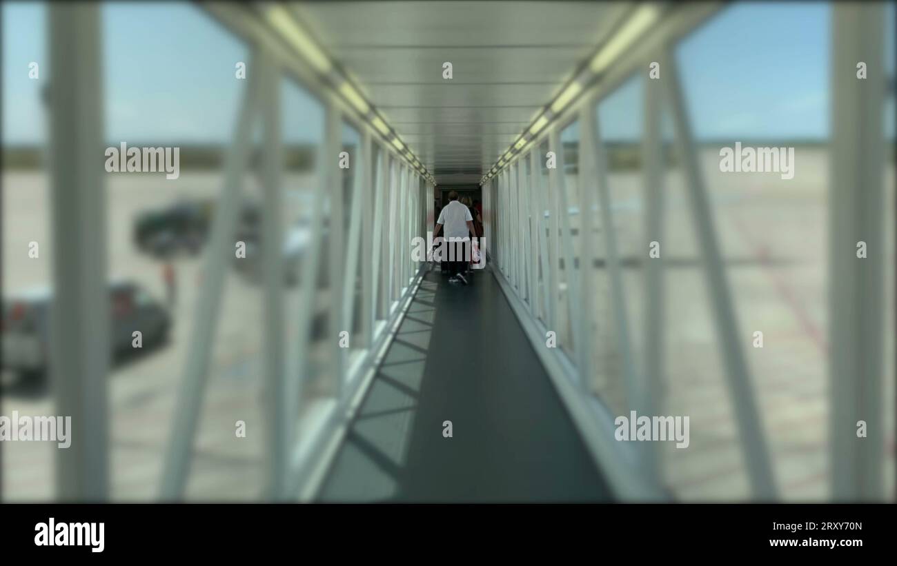 Passenger perspective boarding plane corridor. POV person walking ...