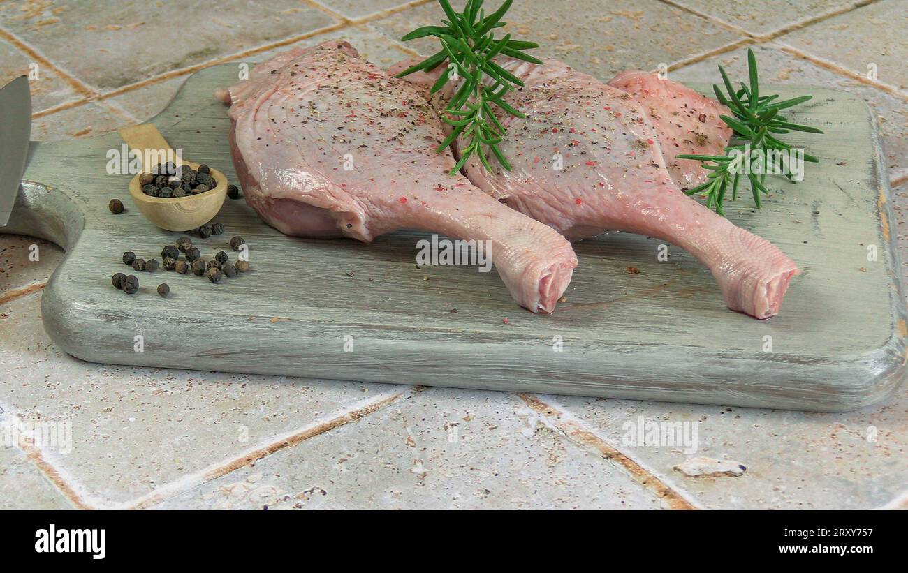 raw duck legs on a cutting board Stock Photo - Alamy