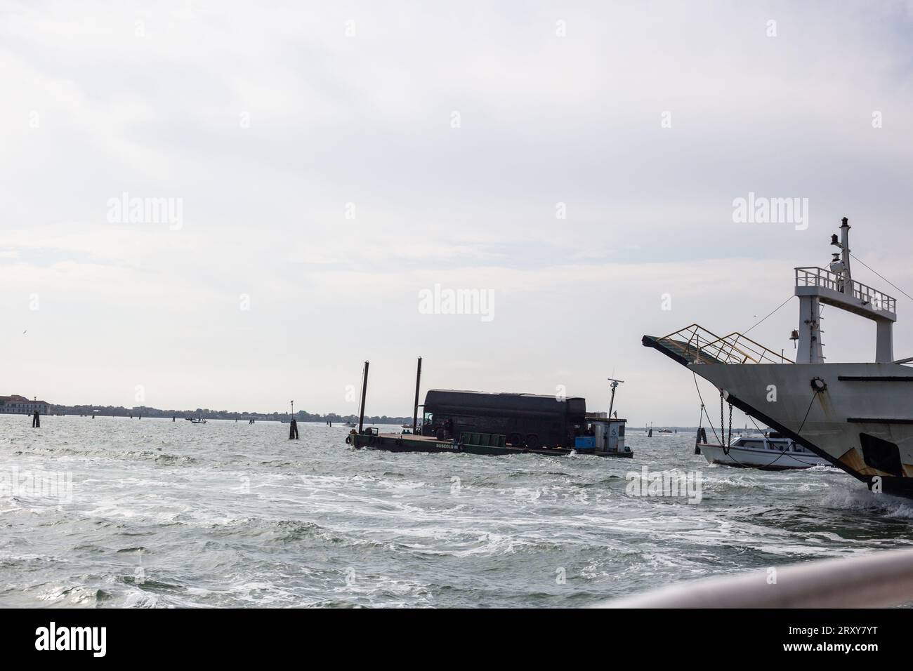 Venice lagoon, Italy, September 2023, a double decker bus is the cargo ...