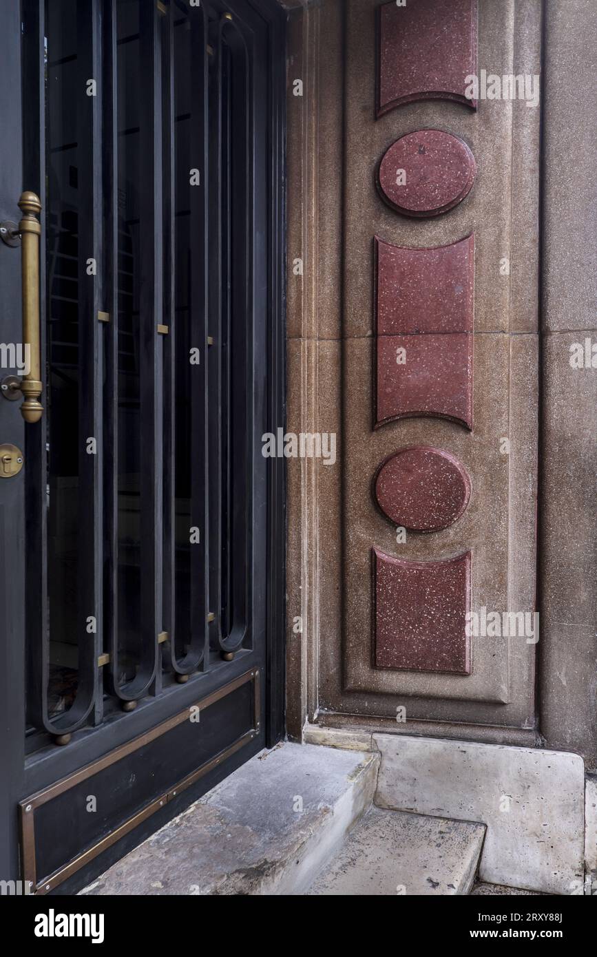 Access portal to a building with black metal door Stock Photo - Alamy